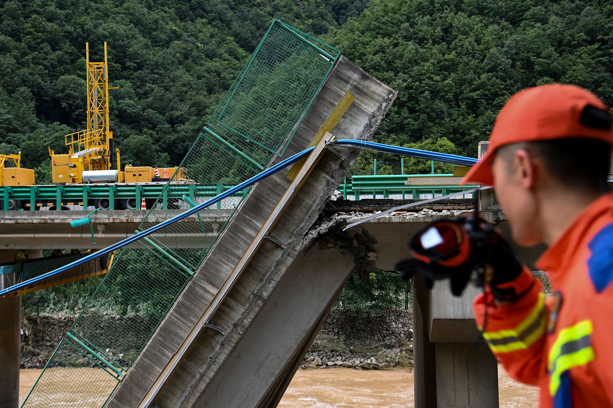 Death toll from bridge collapse in China's Shaanxi province raised to 38. Two dozen still ...