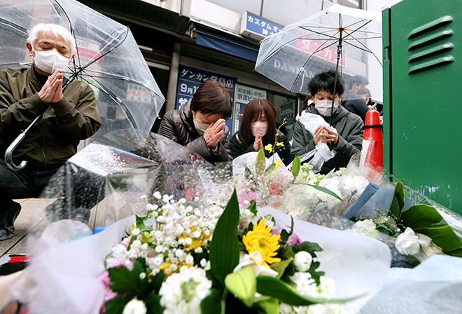 Mourners gather on anniversary of Osaka arson at mental clinic | The ...