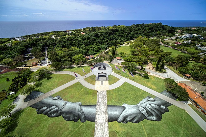 Massive painting of interlocking hands created in Okinawan park | The ...